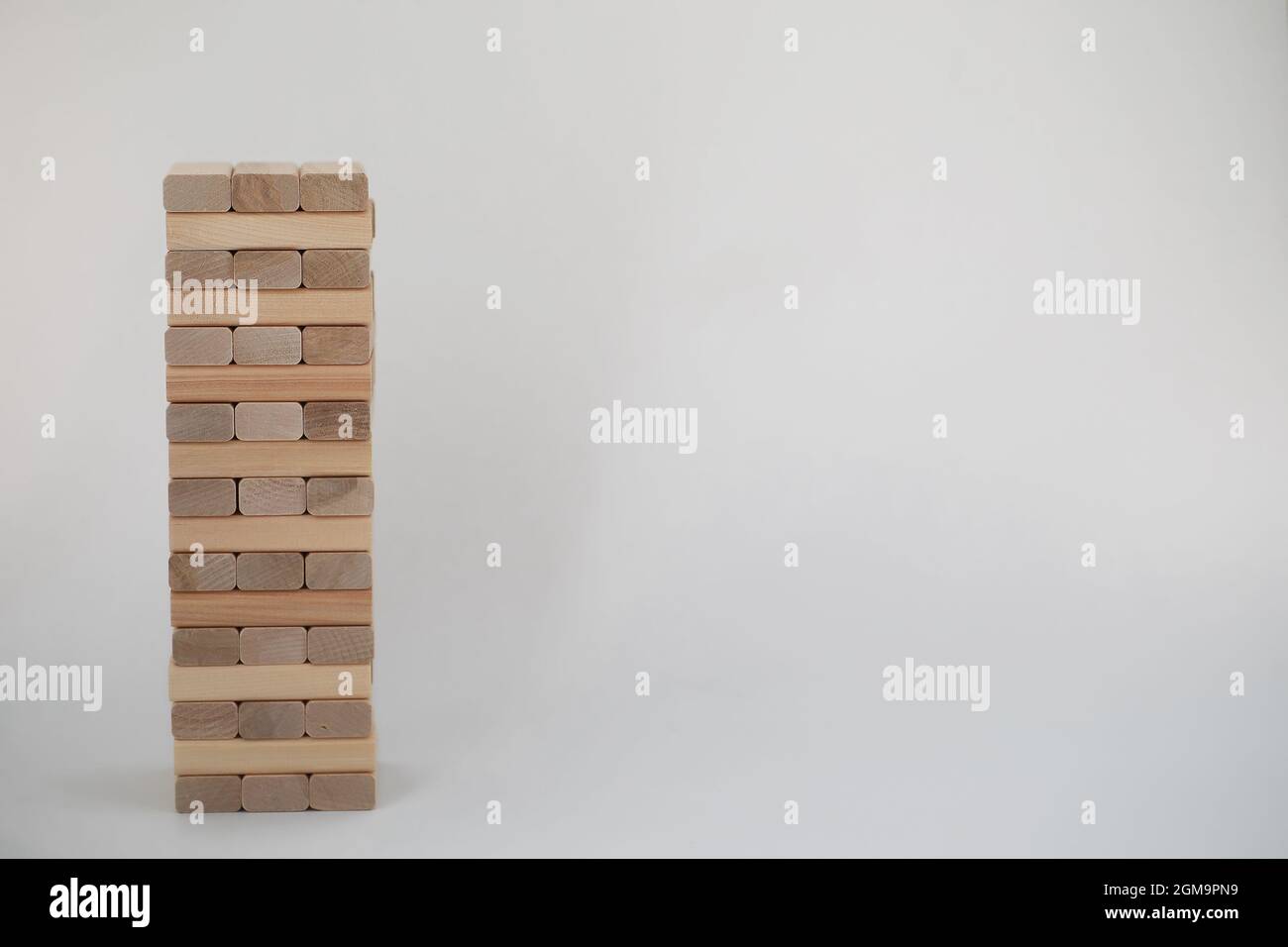 Board game jenga tower of light wood sticks Stock Photo - Alamy