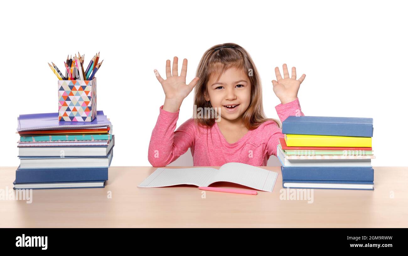 Cute little girl with lot of homework to do against white background ...