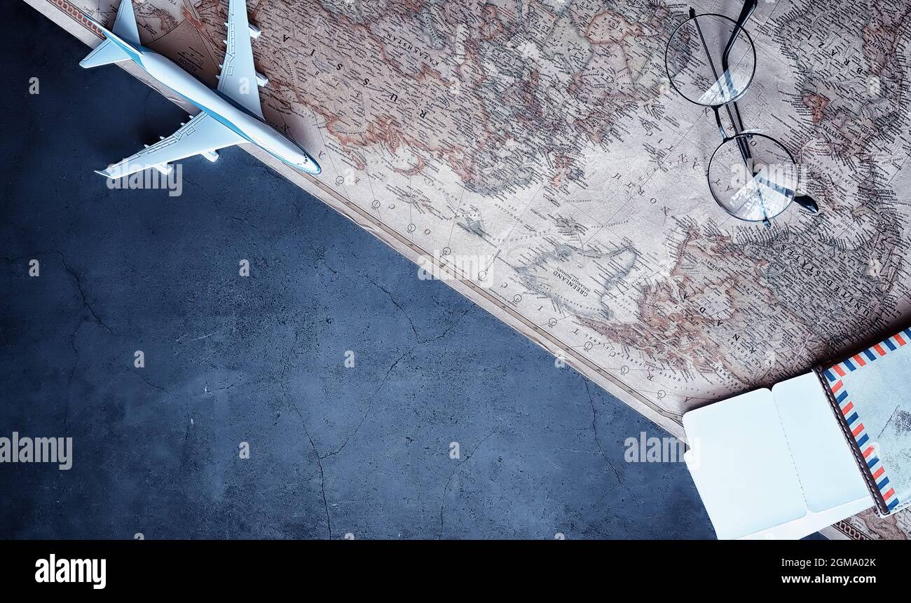 Travel concept. Map on the table and model aircraft Stock Photo - Alamy