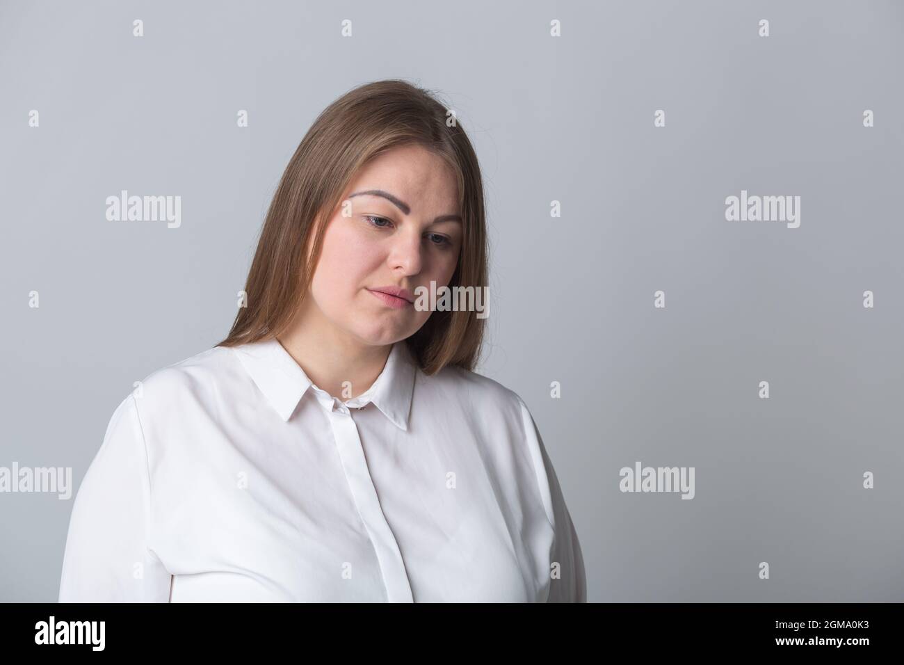 Sad overweight young woman portrait. Unhappy white Caucasian female in ...