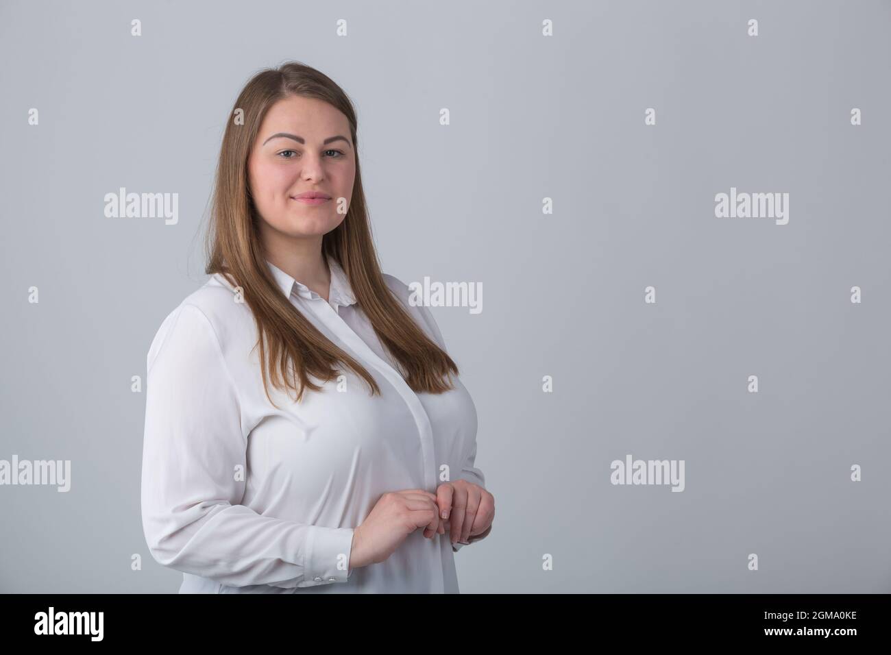 Beautiful plus size model wearing classic white shirt Stock Photo - Alamy
