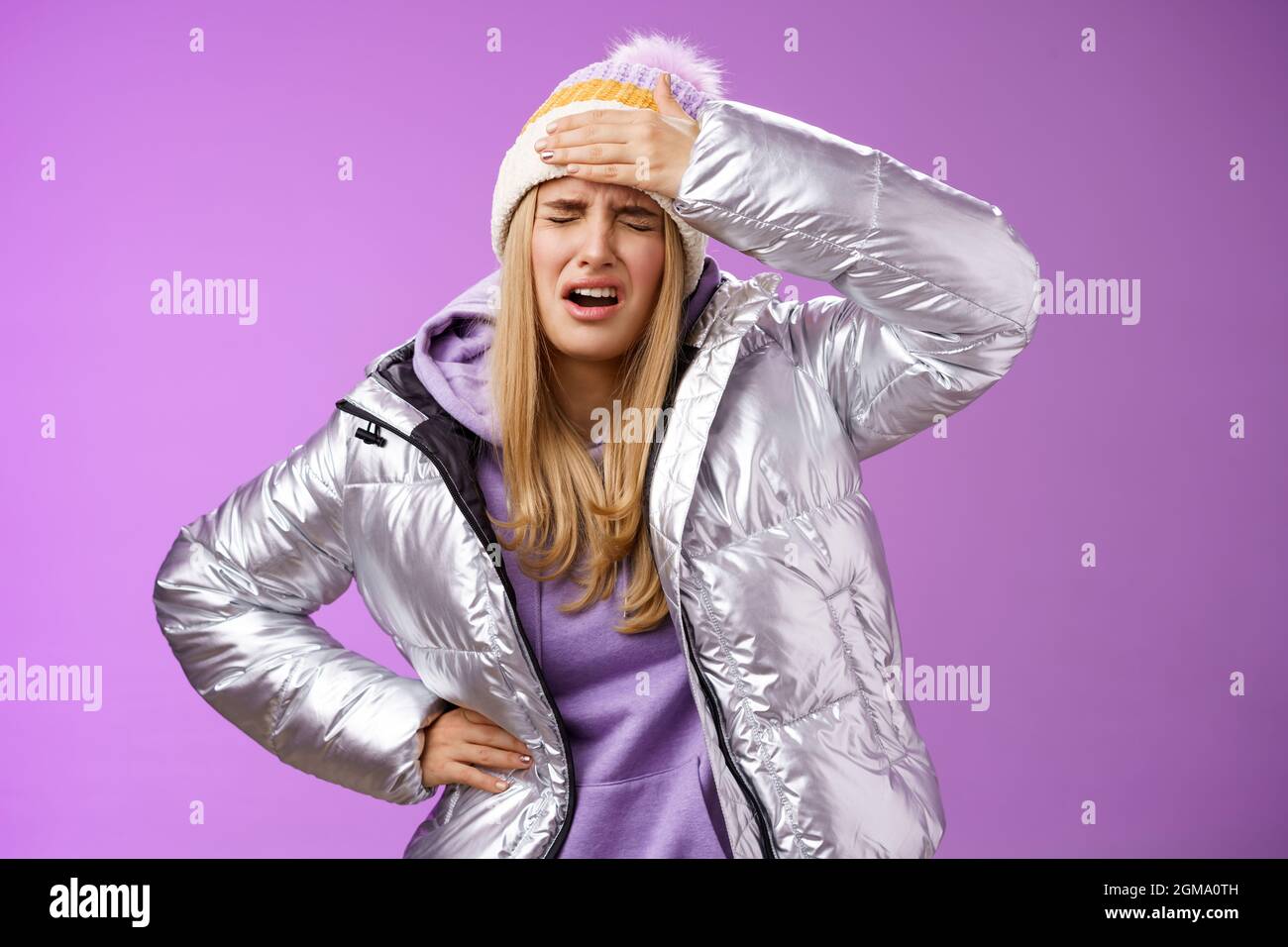 Girl sick tired touch forehead painful feeling grimacing complaining ...