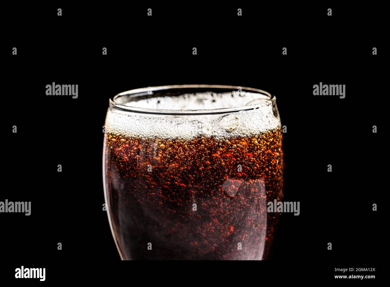 Glass of refreshing cola on black background, closeup Stock Photo - Alamy