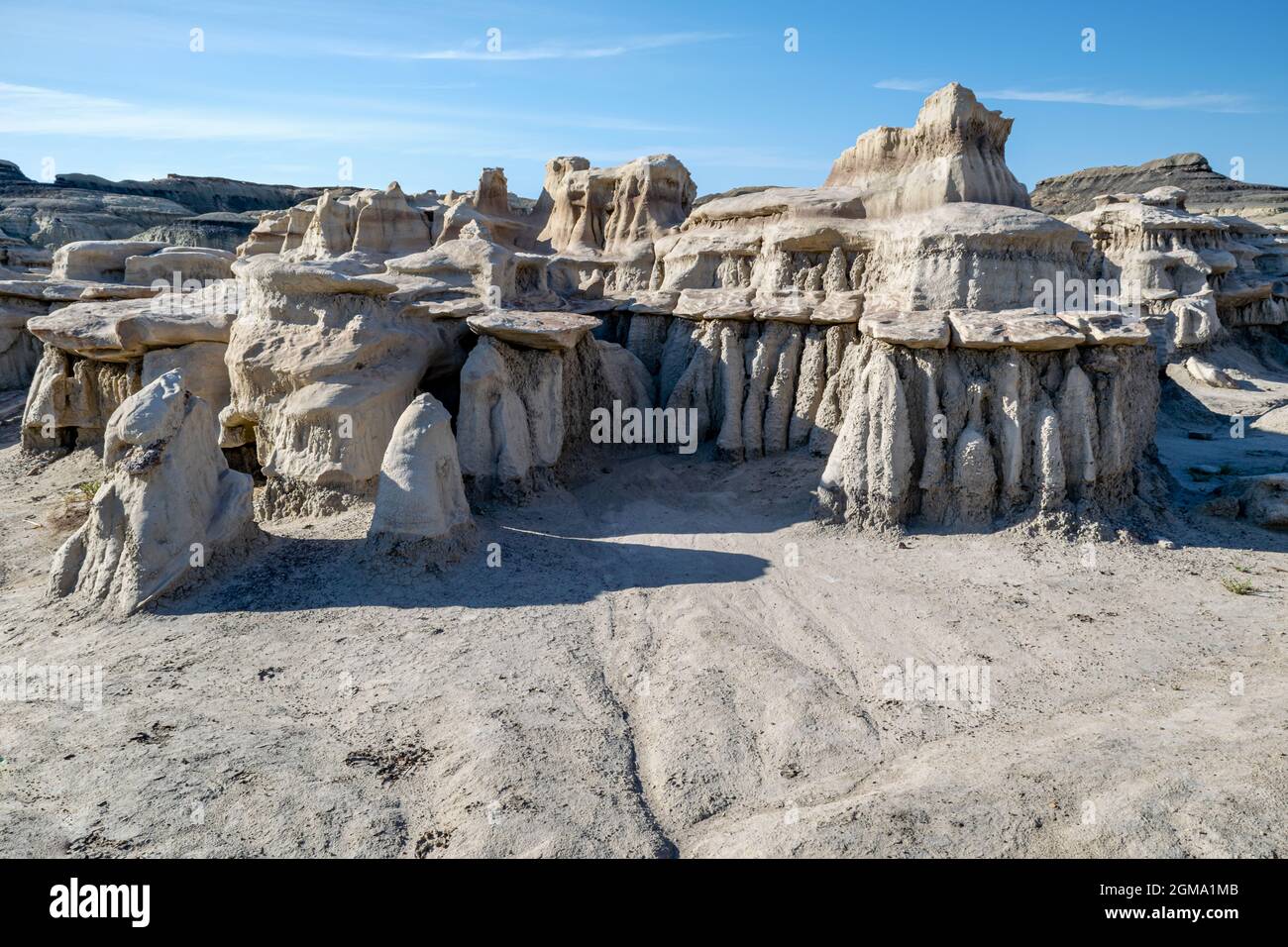 Intricate columns seemingly hold up horizontal layers of sandstone to ...