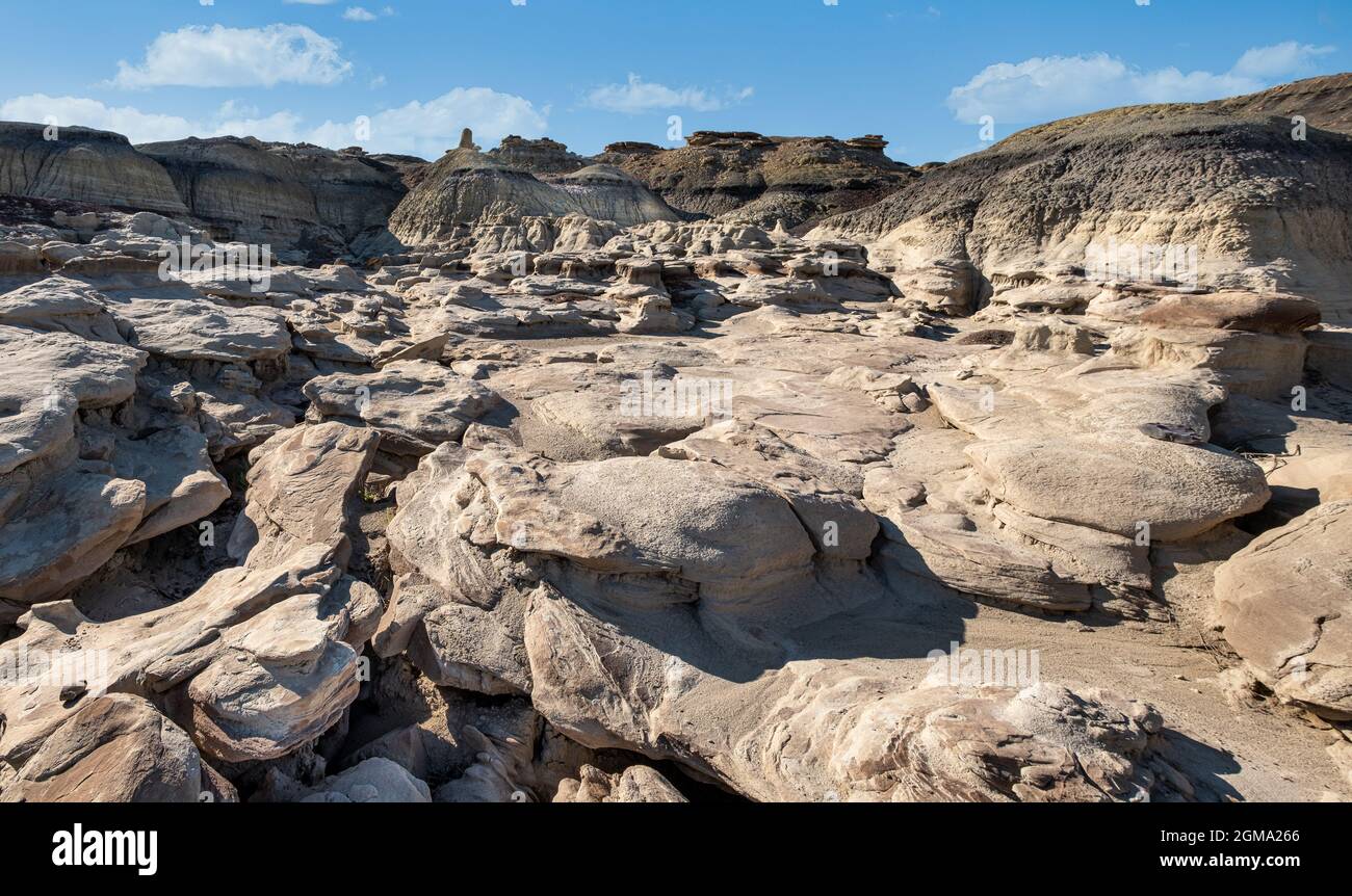 Rocks are strewn right and left along a path leading to one of the ...