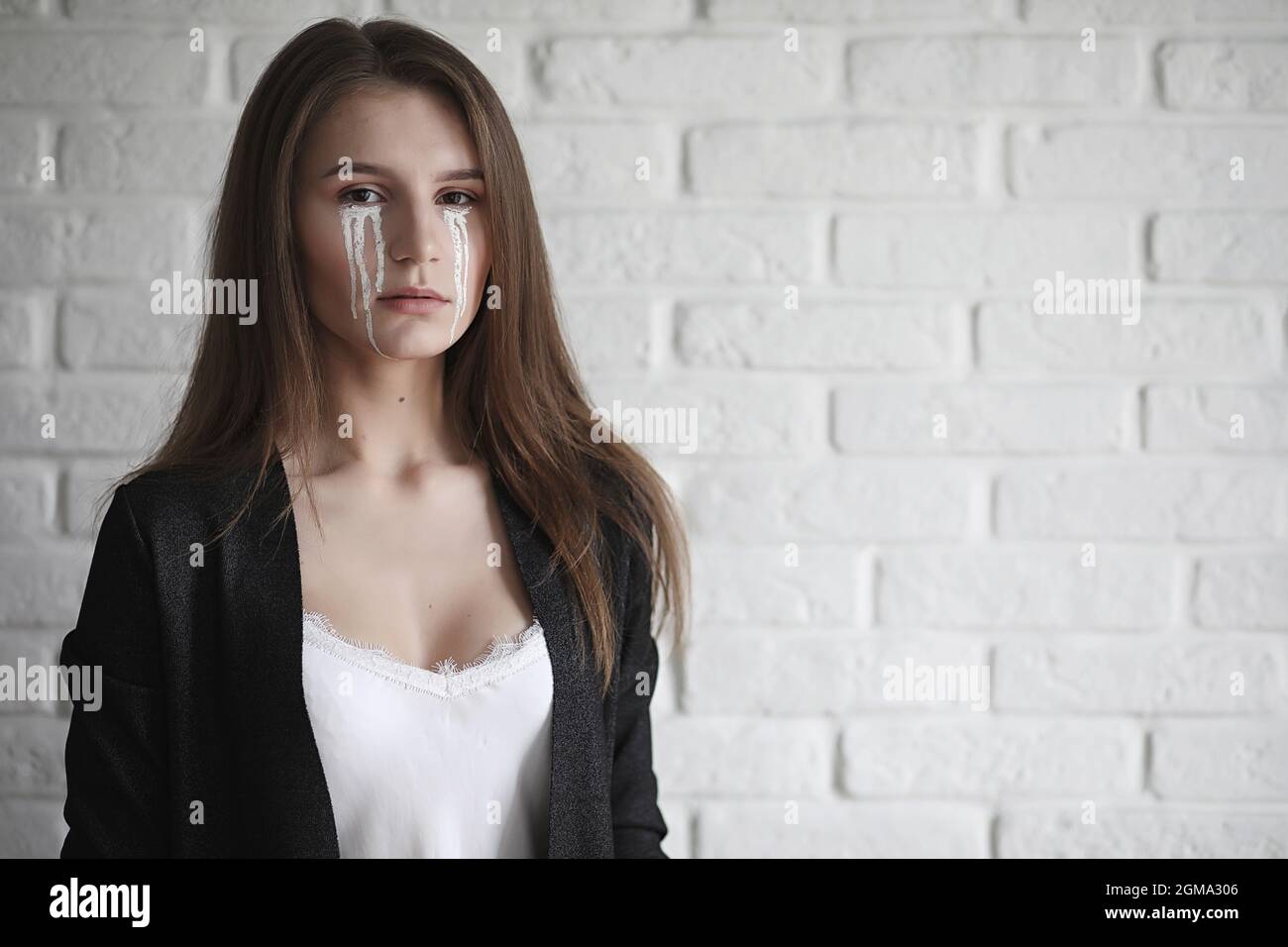 Beautiful girl with tears in eyes. Young girl with painted tears posing ...