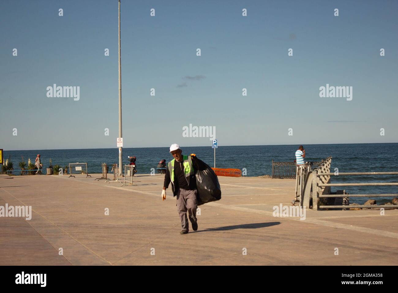 old man collecting garbage for little money. life is really hard for ...