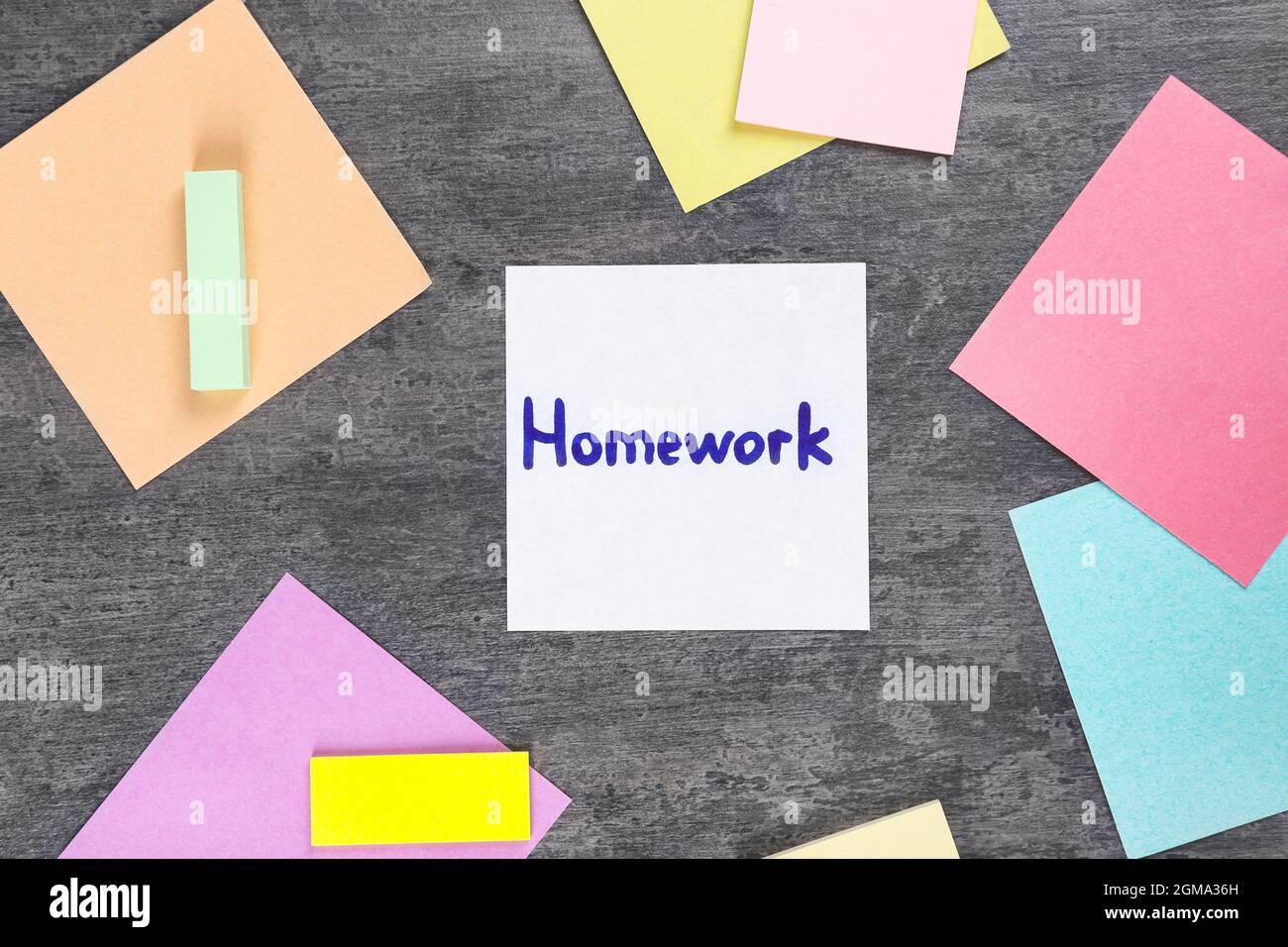 Note with word "Homework" on table, top view Stock Photo - Alamy