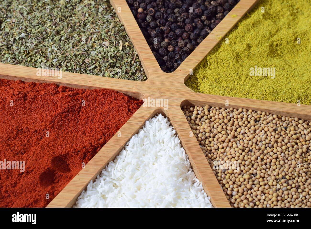 Colorful mix of spices in a wooden container. Food. Oriental spices ...