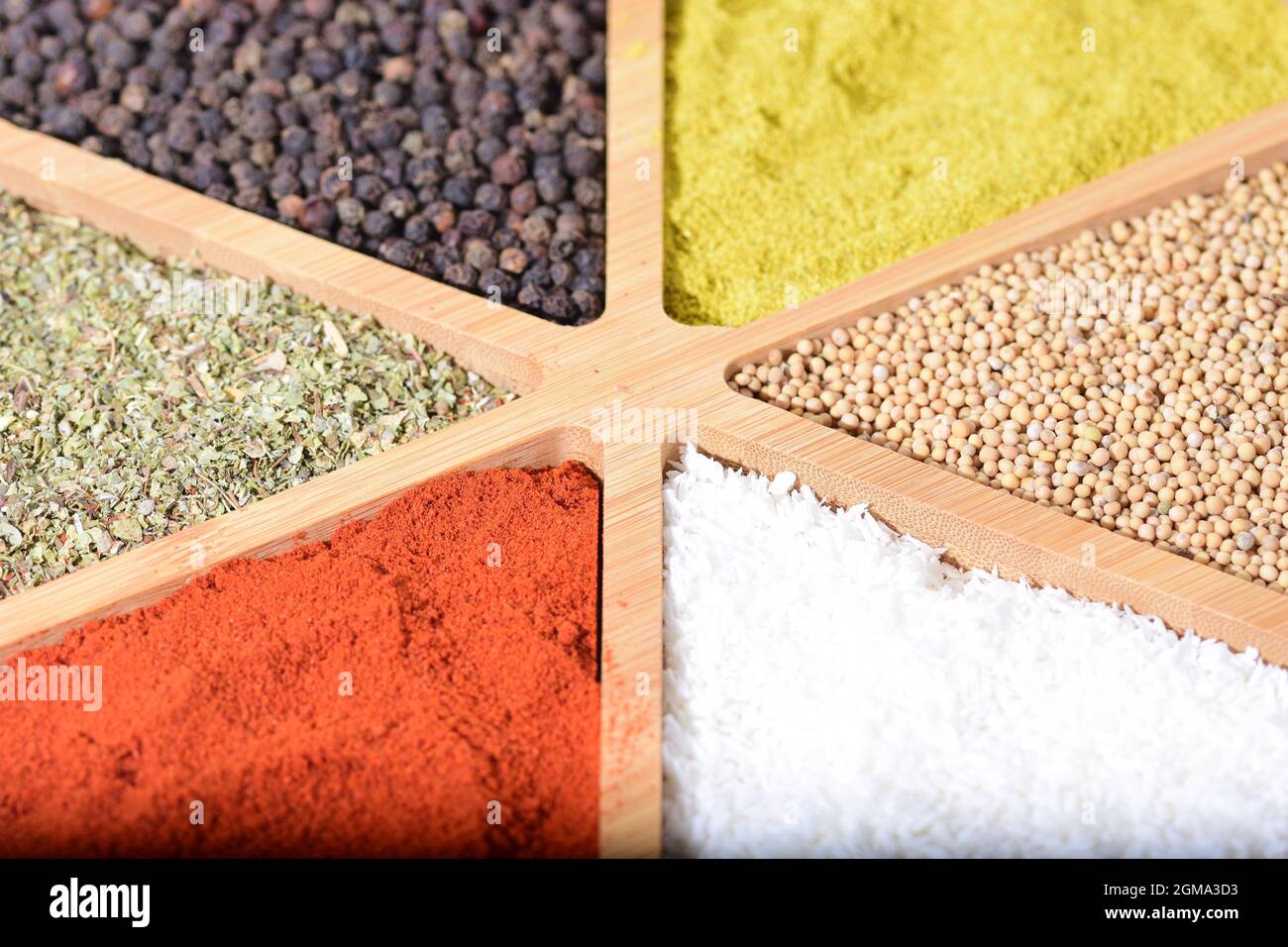 Colorful mix of spices in a wooden container. Food. Oriental spices ...