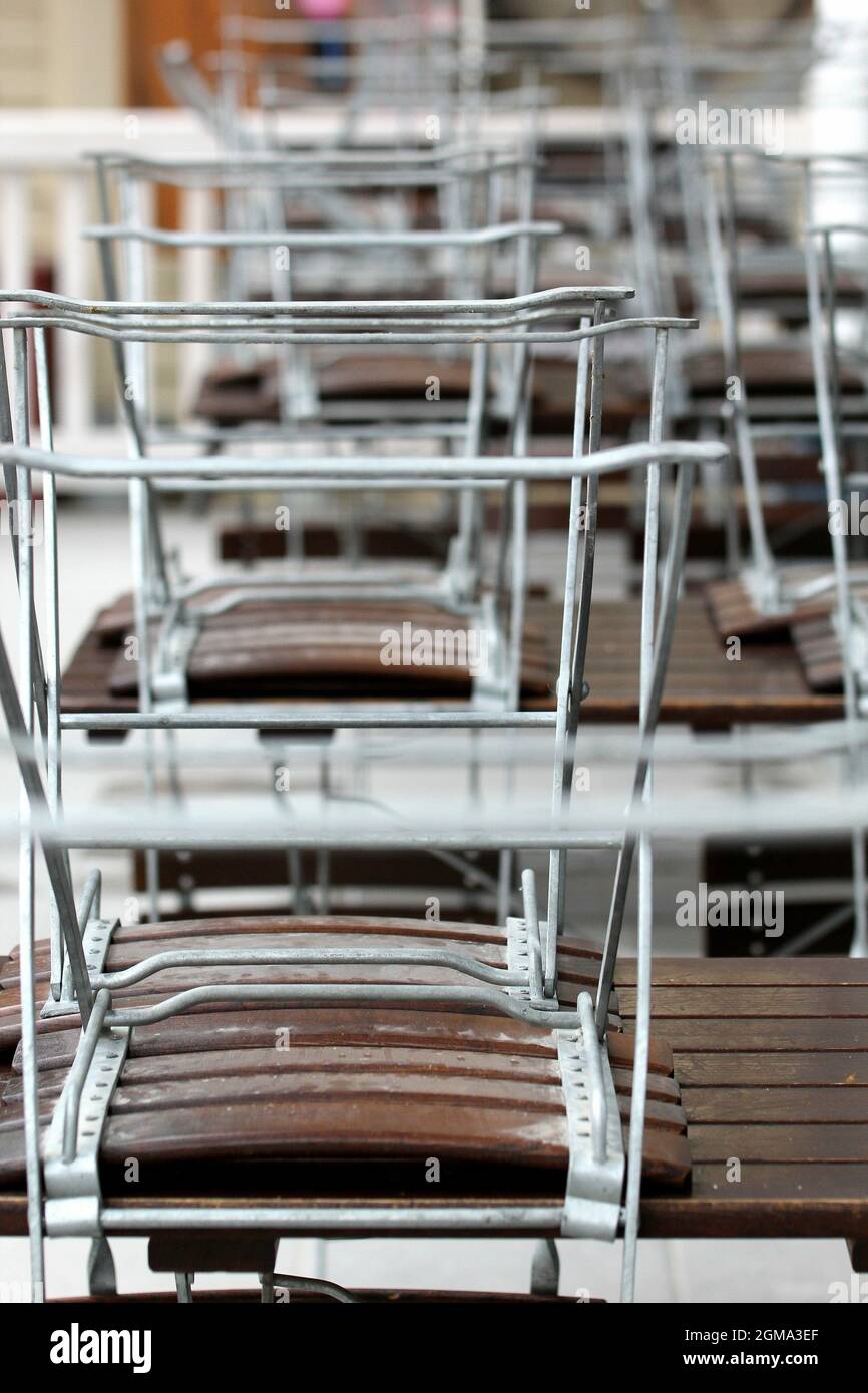 Vertical shot of chairs and tables of an outdoor cafe Stock Photo - Alamy