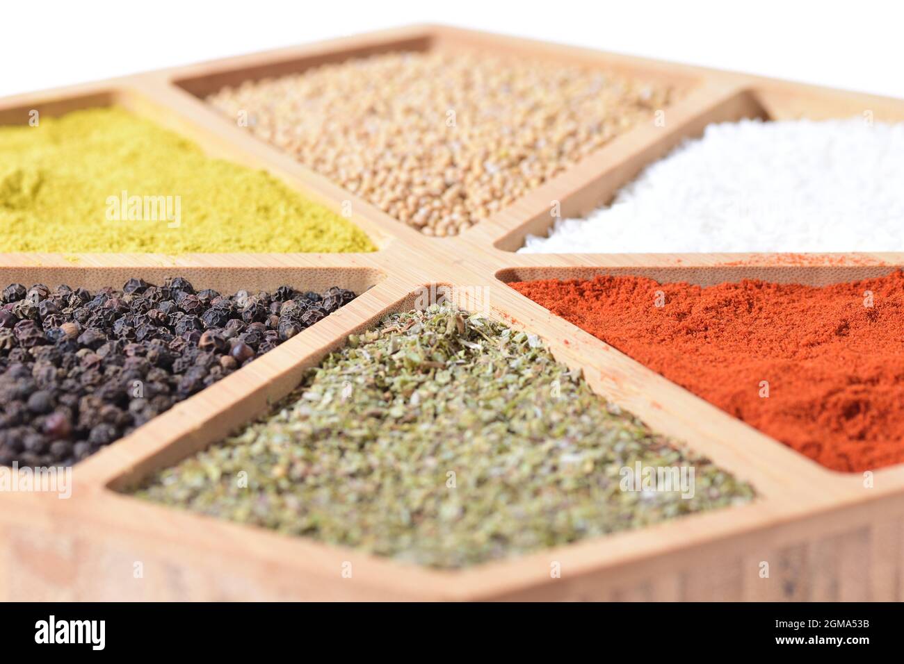 Colorful mix of spices in a wooden container. Food. Oriental spices ...