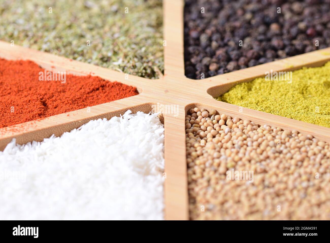 Colorful mix of spices in a wooden container. Food. Oriental spices ...
