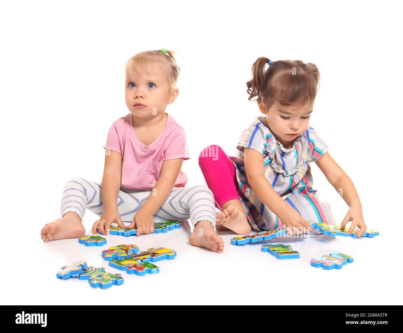 Adorable little children playing on white background Stock Photo - Alamy