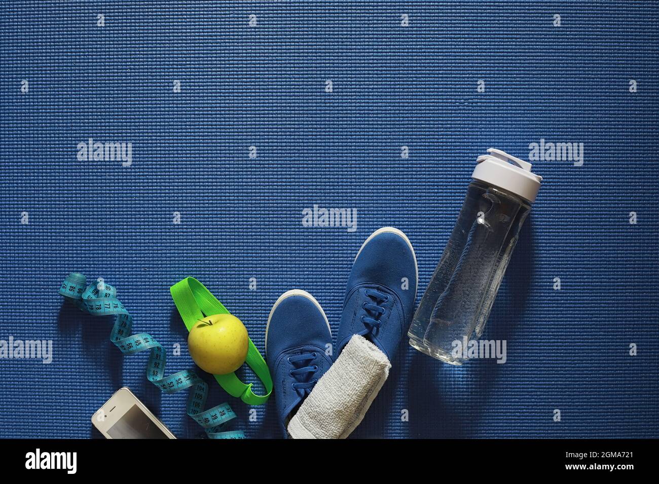 Mat for practicing yoga on a floor. Healthy lifestyle Stock Photo - Alamy