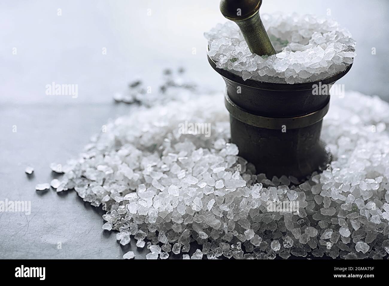 Large sea salt. Spice. Mortar and pestle for grinding salt Stock Photo ...