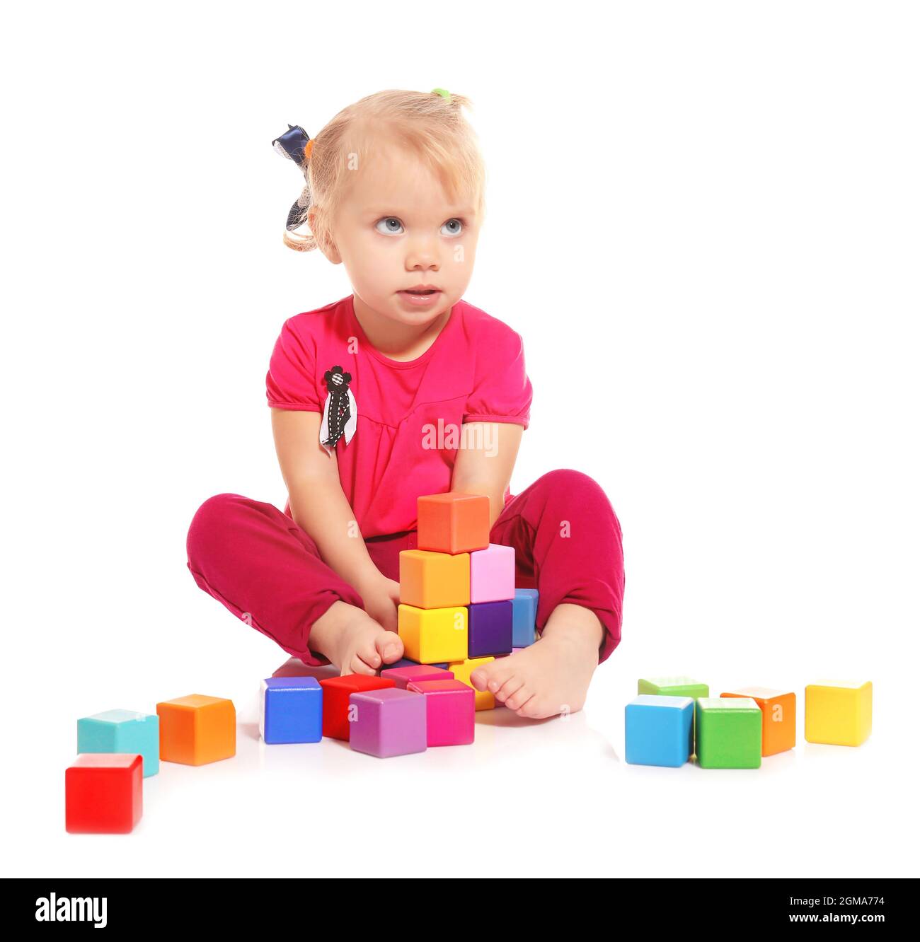 Adorable little girl playing with blocks on white background Stock ...