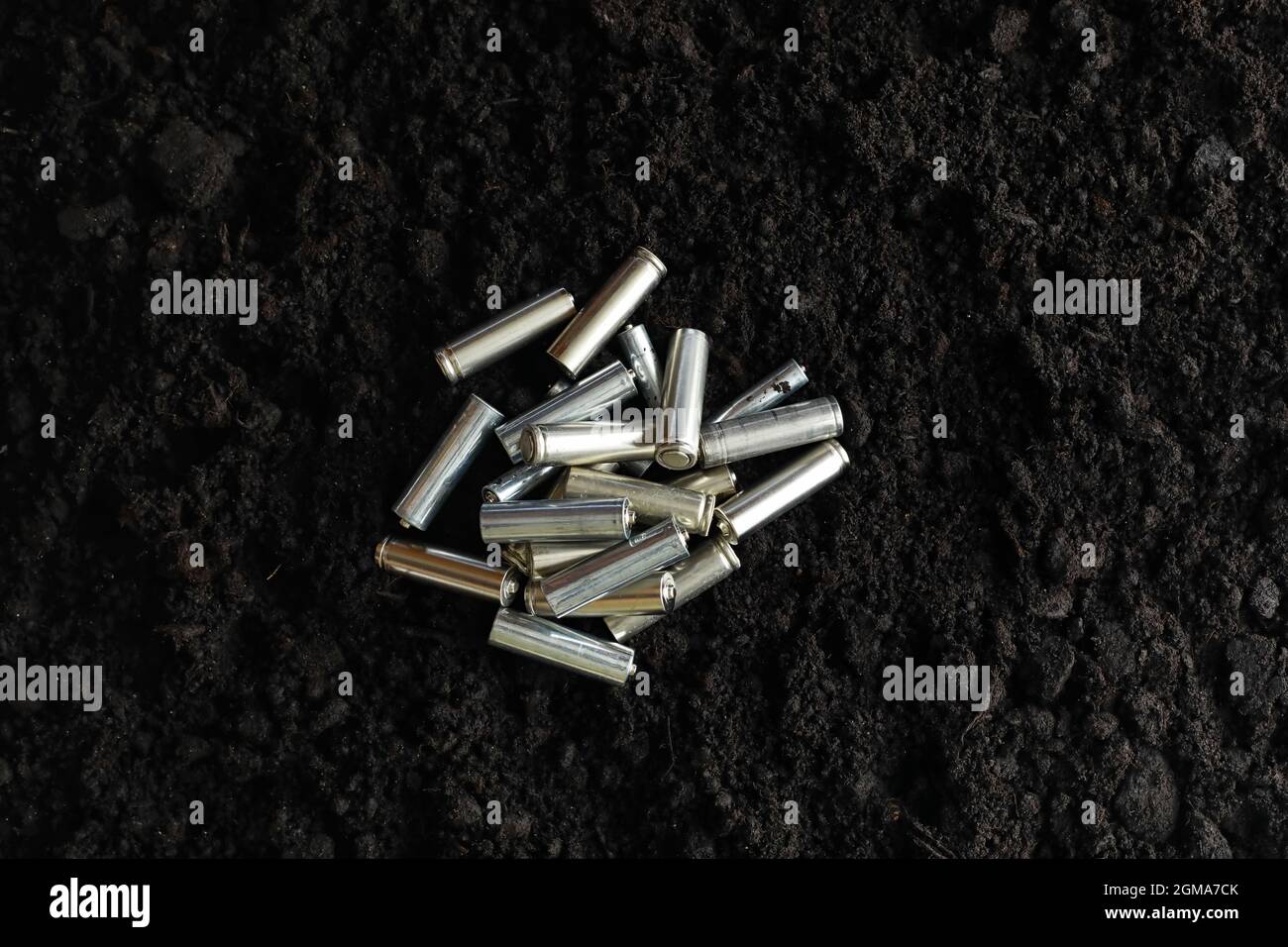 Batteries in the ground. Environmental pollution Stock Photo - Alamy