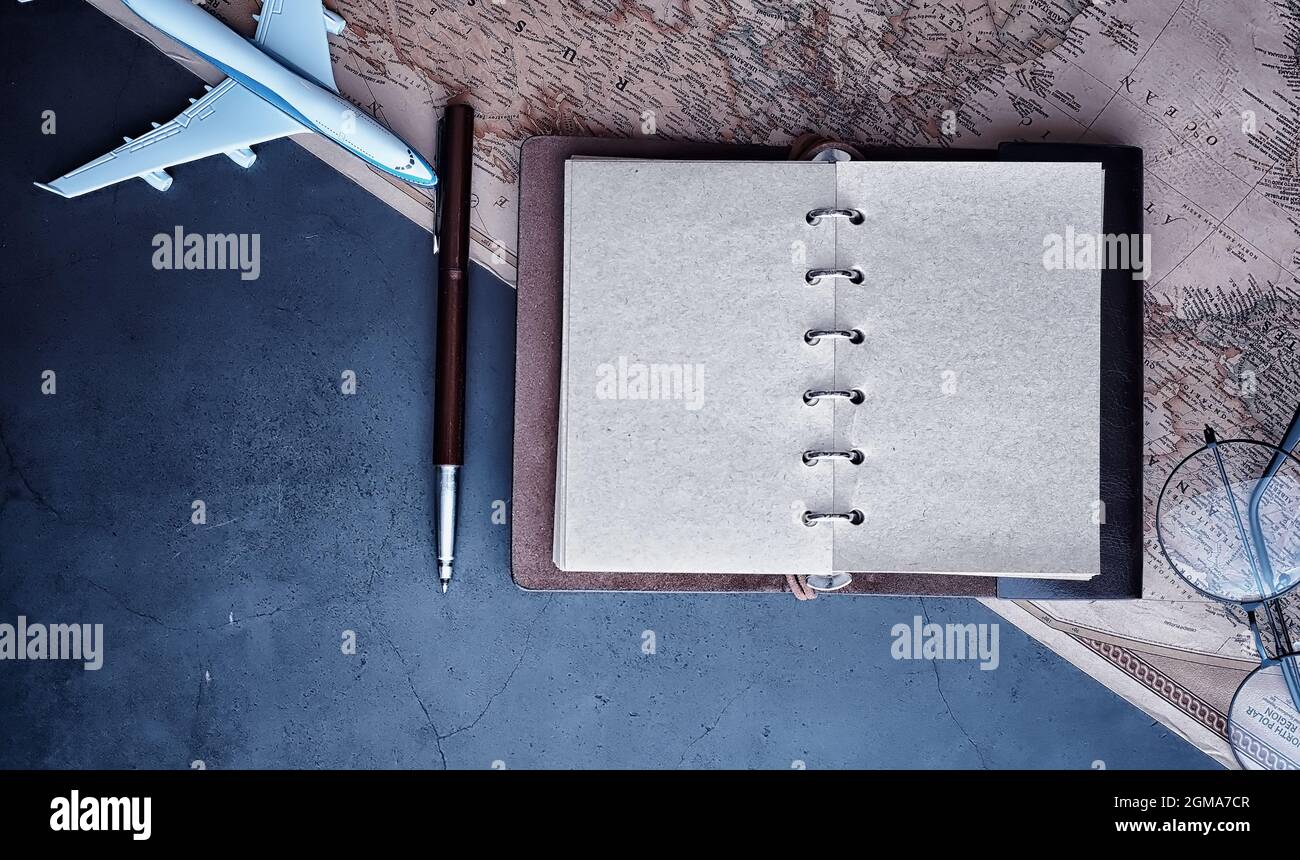 Travel concept. Map on the table and model aircraft Stock Photo - Alamy