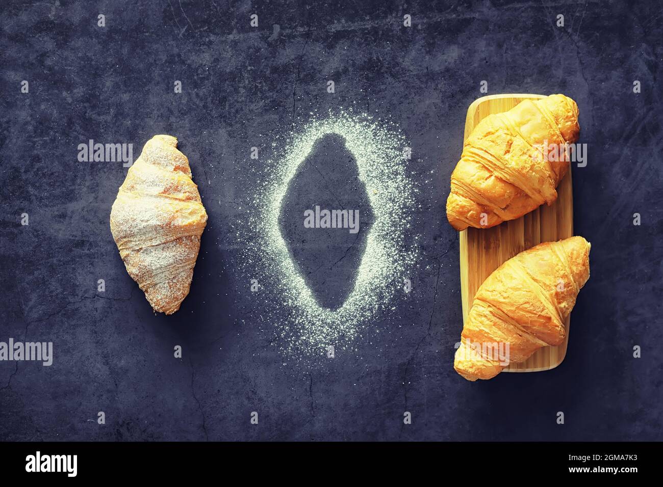 Fresh pastries on the table. French flavored croissant for breakfast ...