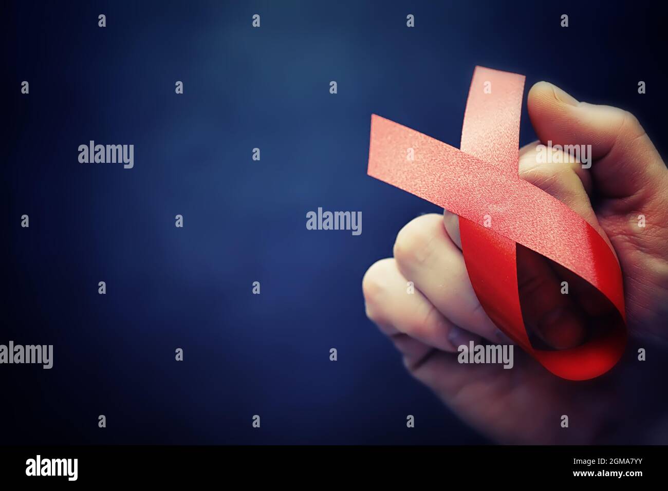 Symbol of human immunodeficiency virus disease. Red ribbon. A helping ...