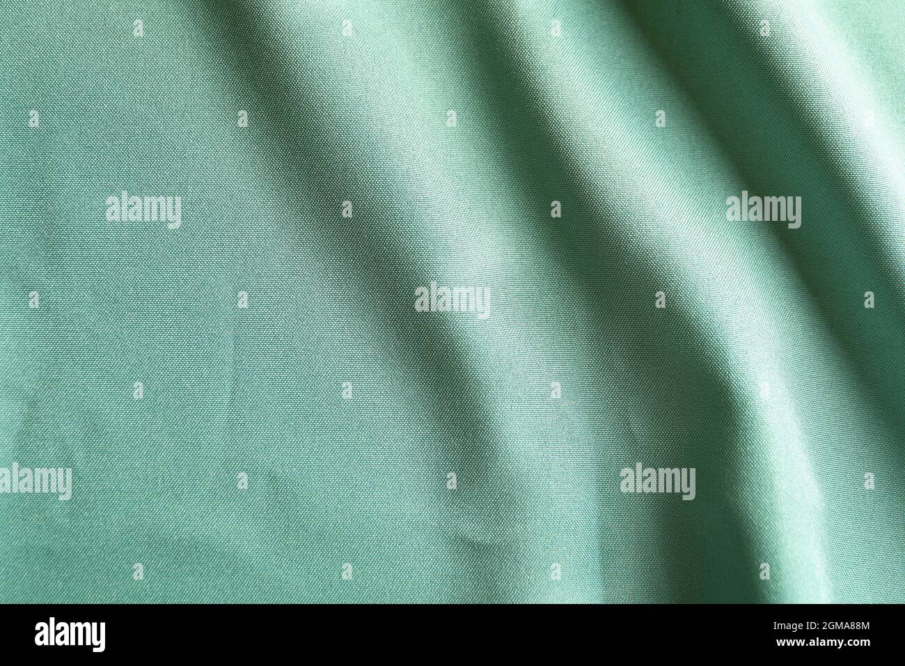 Fabric texture with folds as background Stock Photo - Alamy