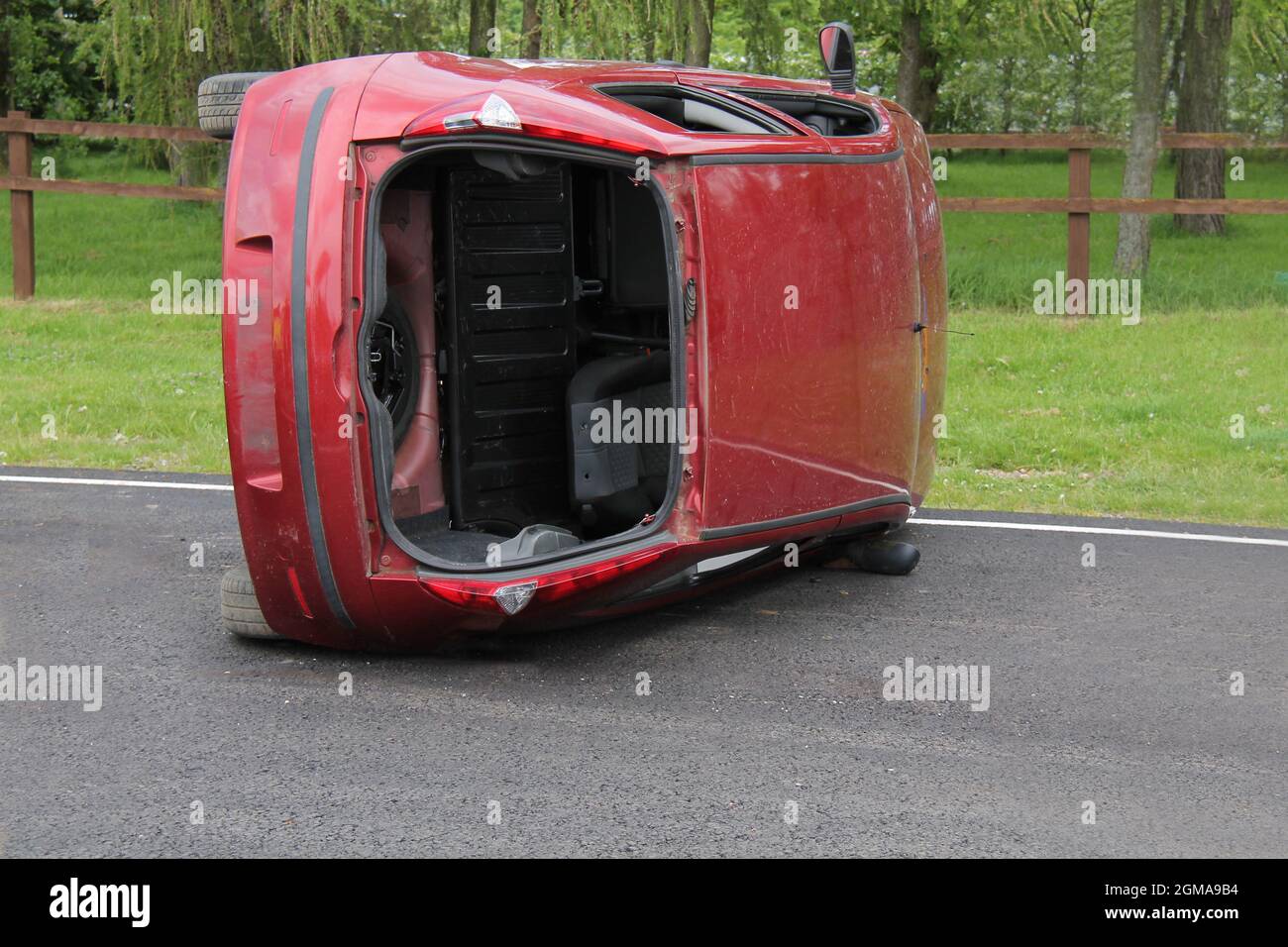 A Smashed Car Accident Wreck on its Side Stock Photo - Alamy