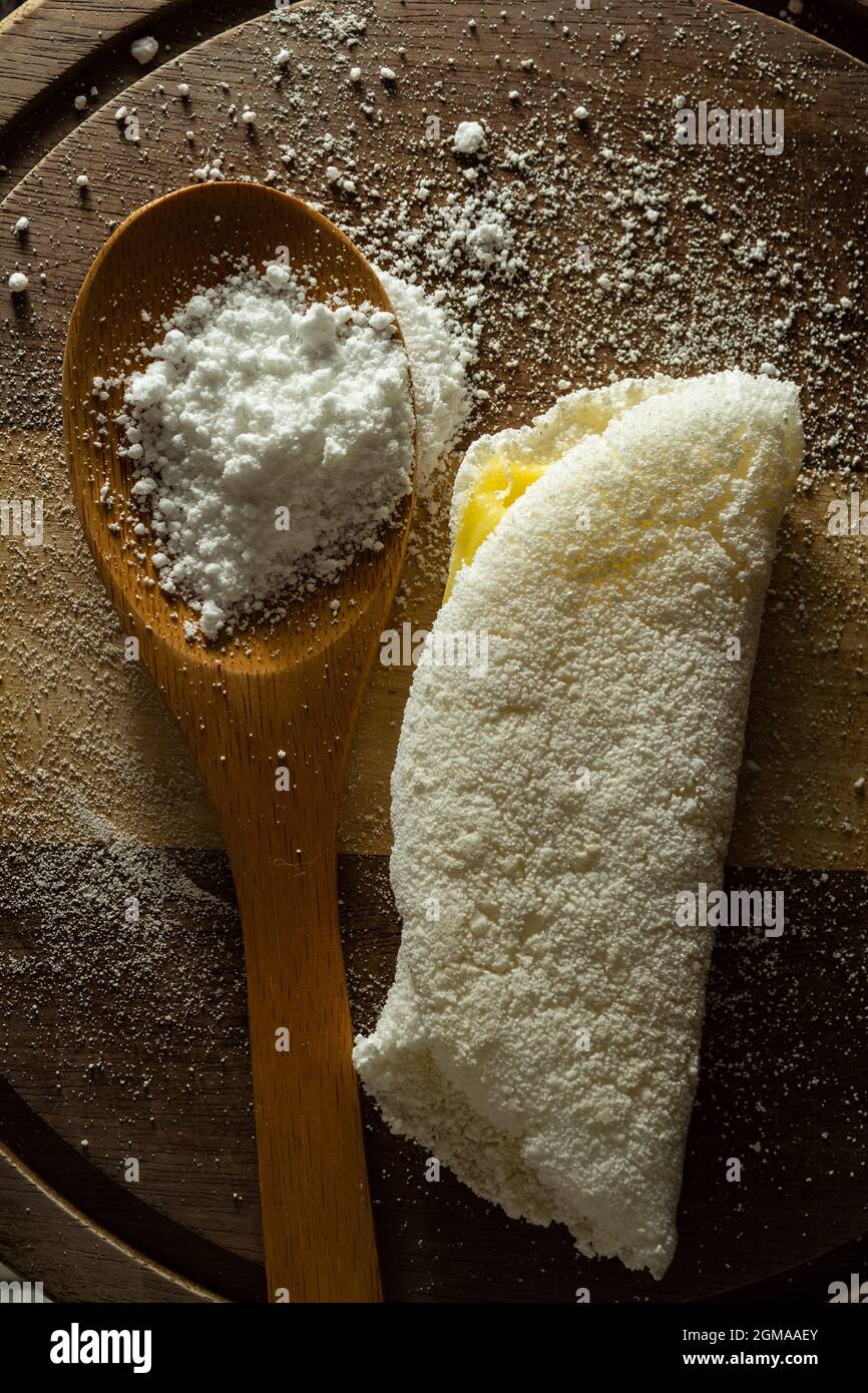 Tapioca, a typical Brazilian dish, with mozzarella filling on a ...