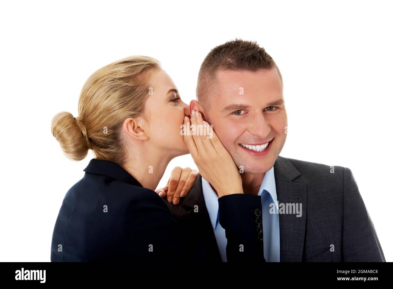Caucasian man and a woman whispering in ear on white background Stock ...