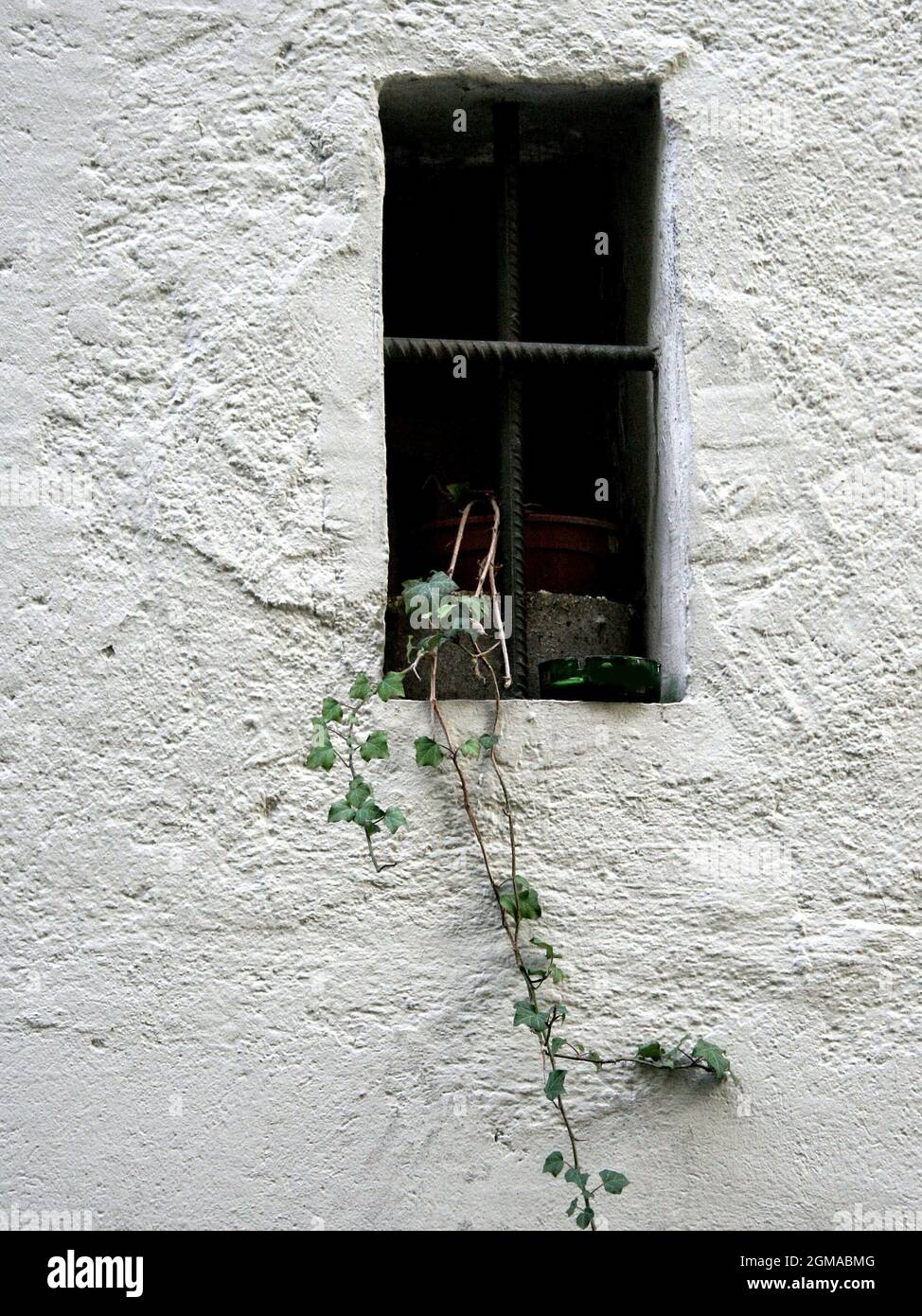 Vertical shot of a small window of a white building Stock Photo - Alamy