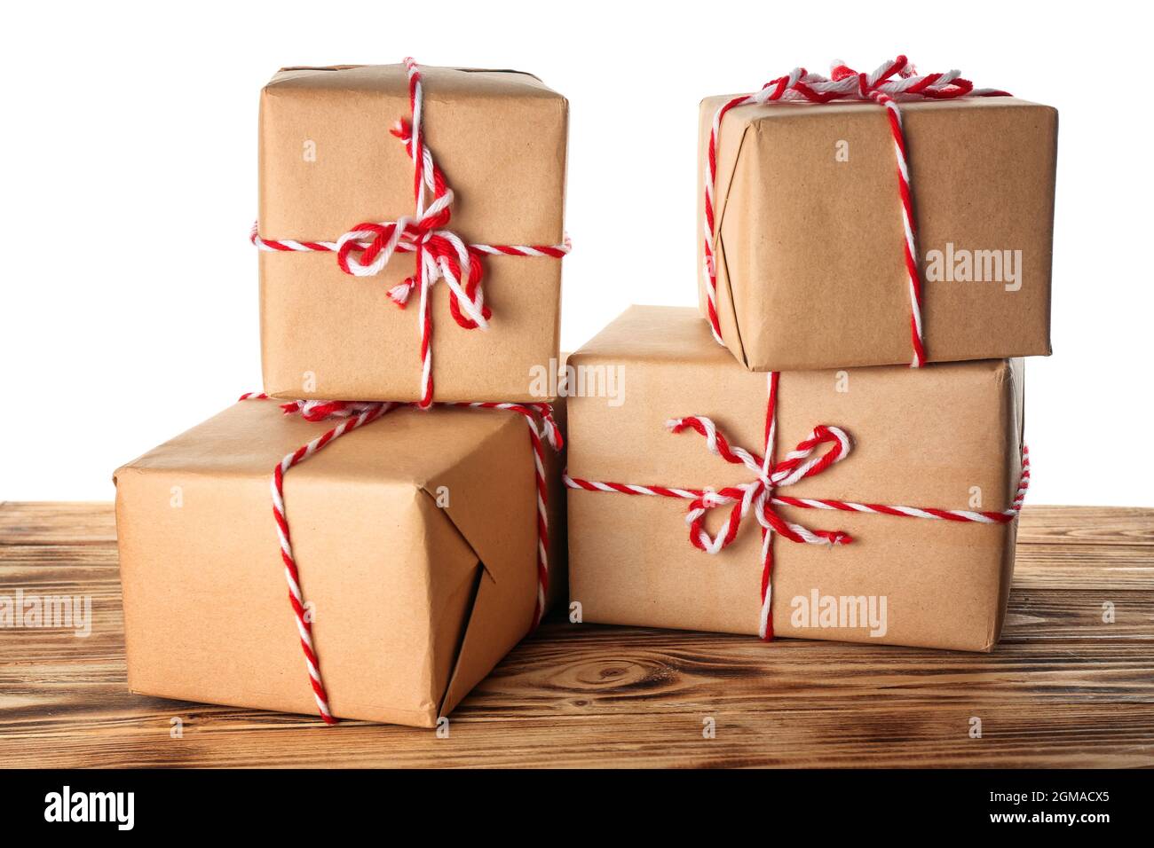 Parcel gift boxes on wooden table against white background Stock Photo ...