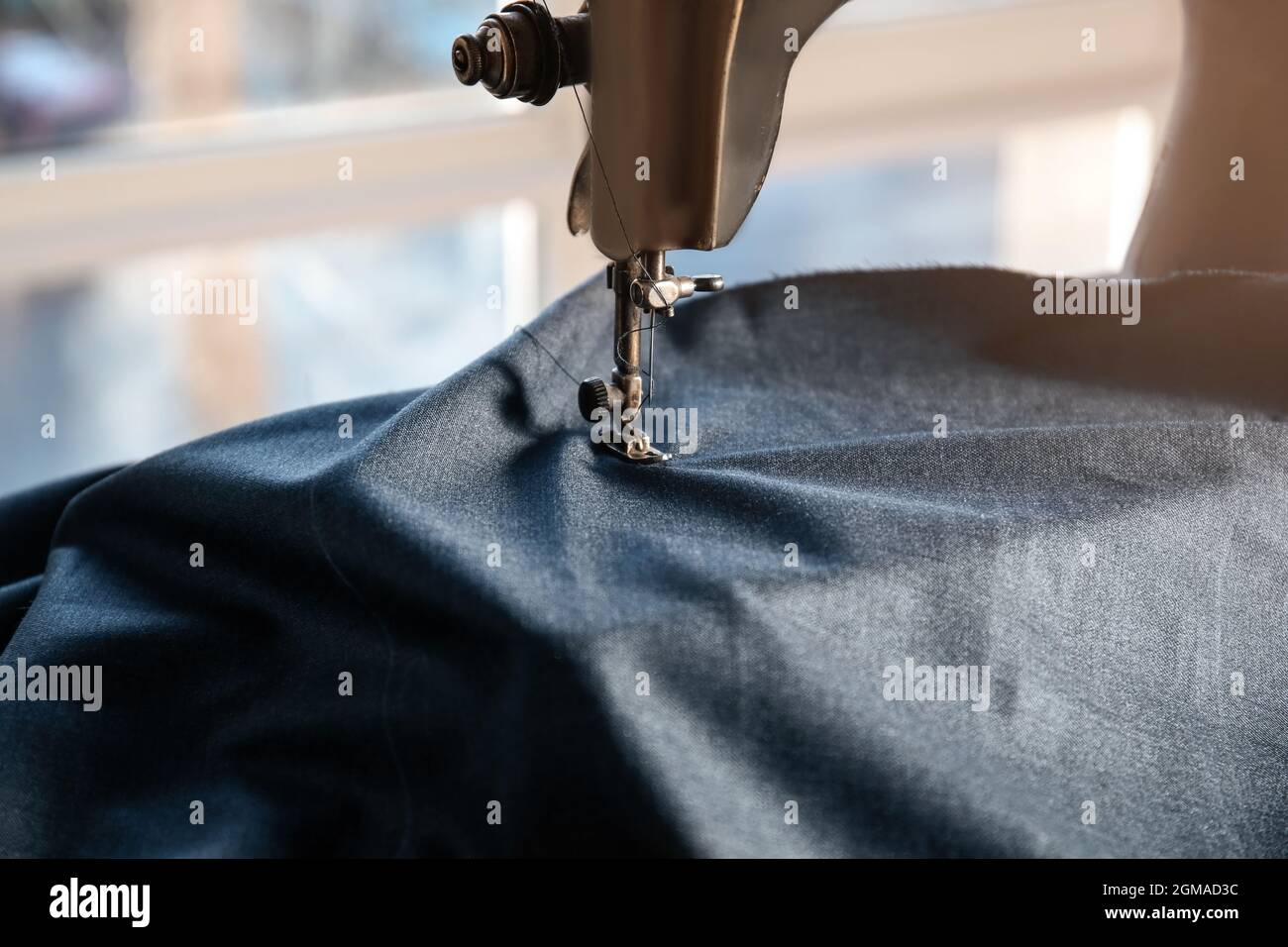 Old sewing machine with fabric, closeup Stock Photo - Alamy