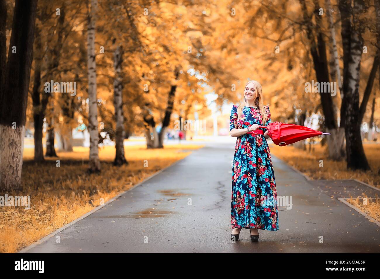 Girl in the street with an umbrella for a walk on a summer day Stock ...