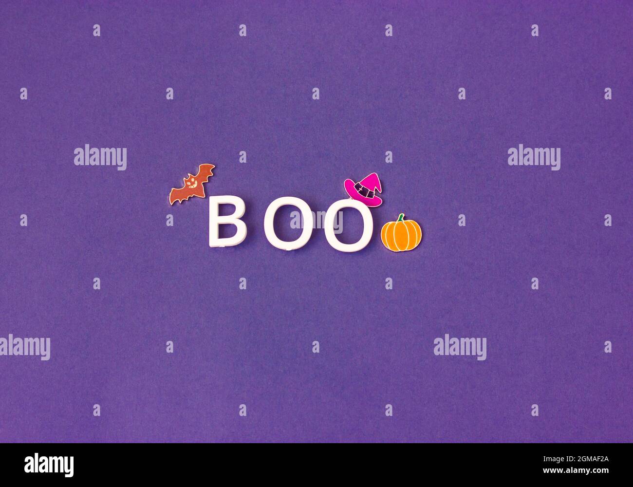 Boo word on purple background. Halloween holiday. Bat, hat, jack ...