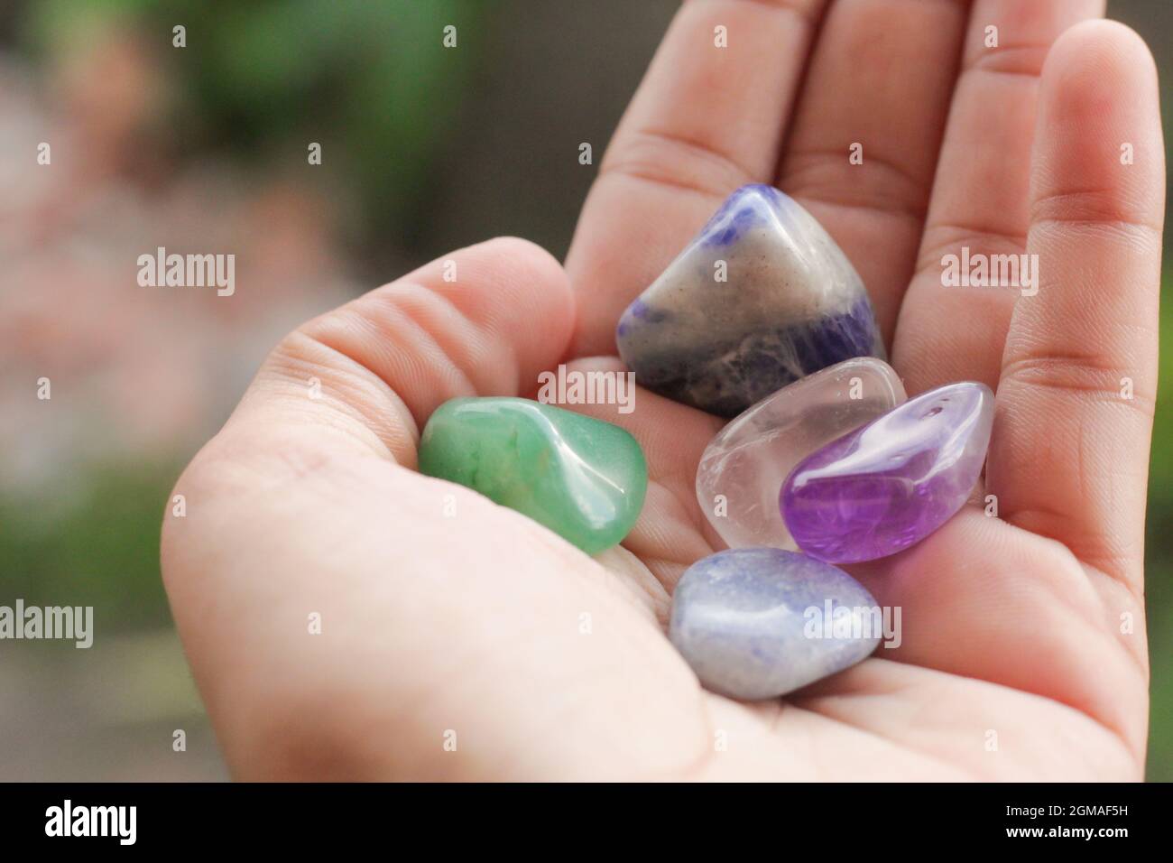Close-Up Photo of Person Holding Crystal Stone Stock Photo - Alamy
