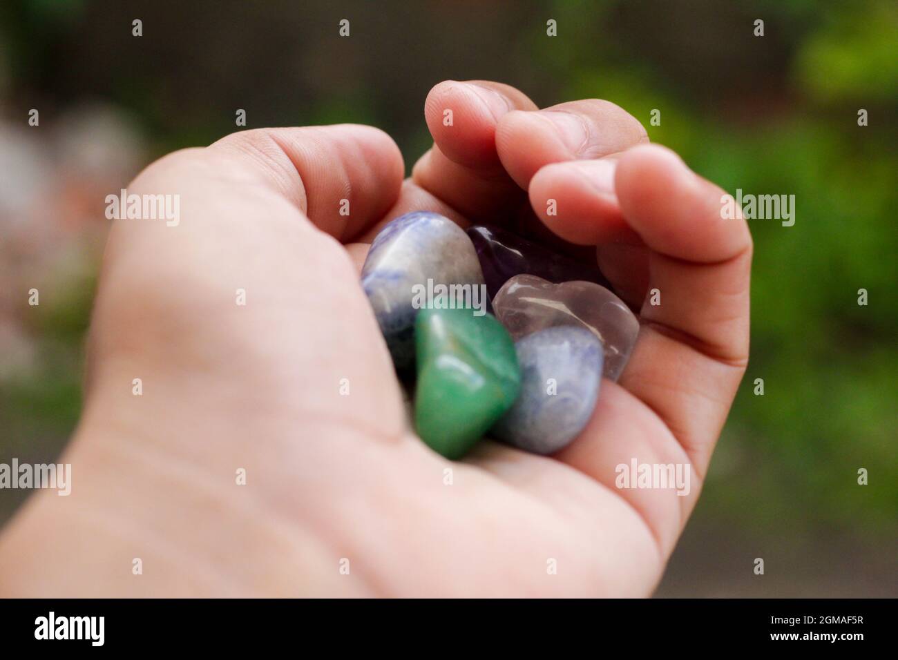 Close-Up Photo of Person Holding Crystal Stone Stock Photo - Alamy