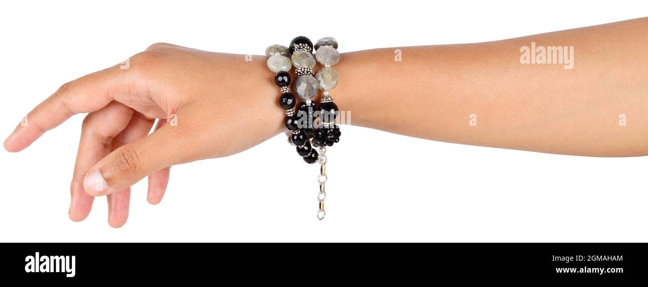 Bracelet in hand isolated on white background Stock Photo - Alamy