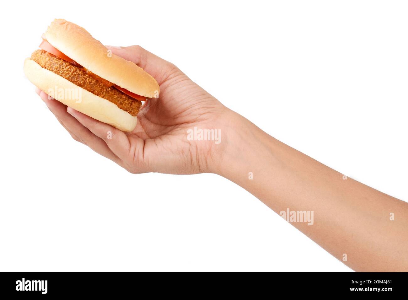 Hand holding a burger on white background. eating and healthy concept ...