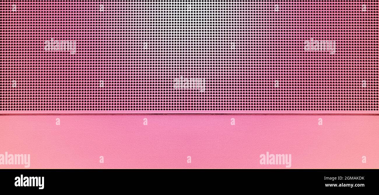 Spot lit perforated pink metal plate. Metal background close-up Stock ...