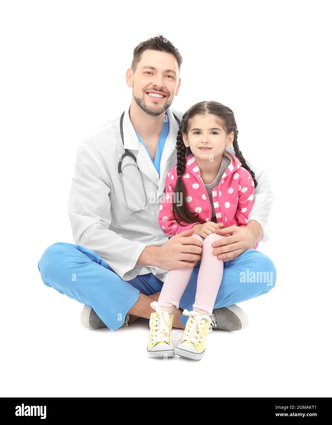 Children's doctor with little girl on white background Stock Photo - Alamy