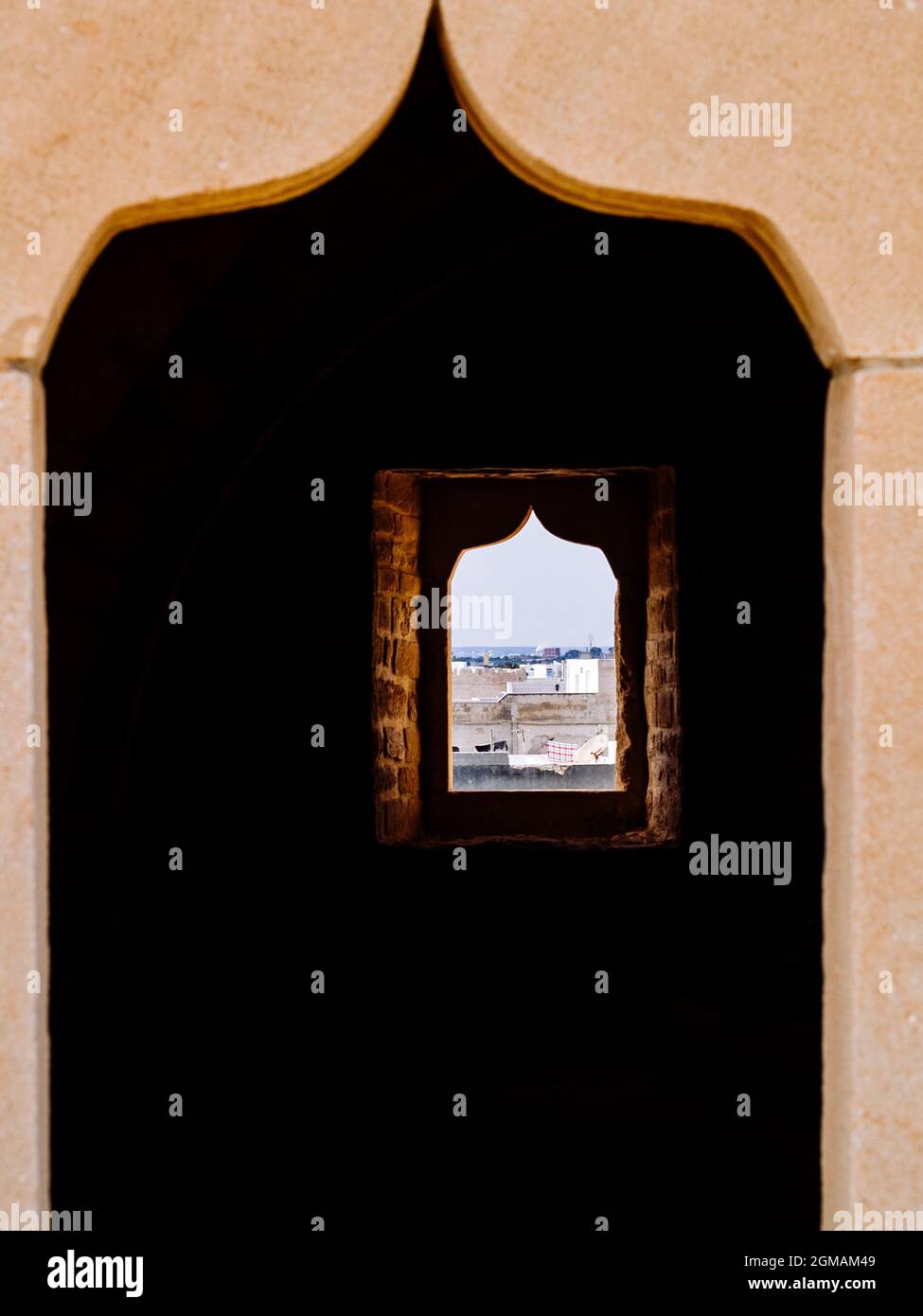 Arabic style windows carved in the red stones of the Borj El-Kebir ...