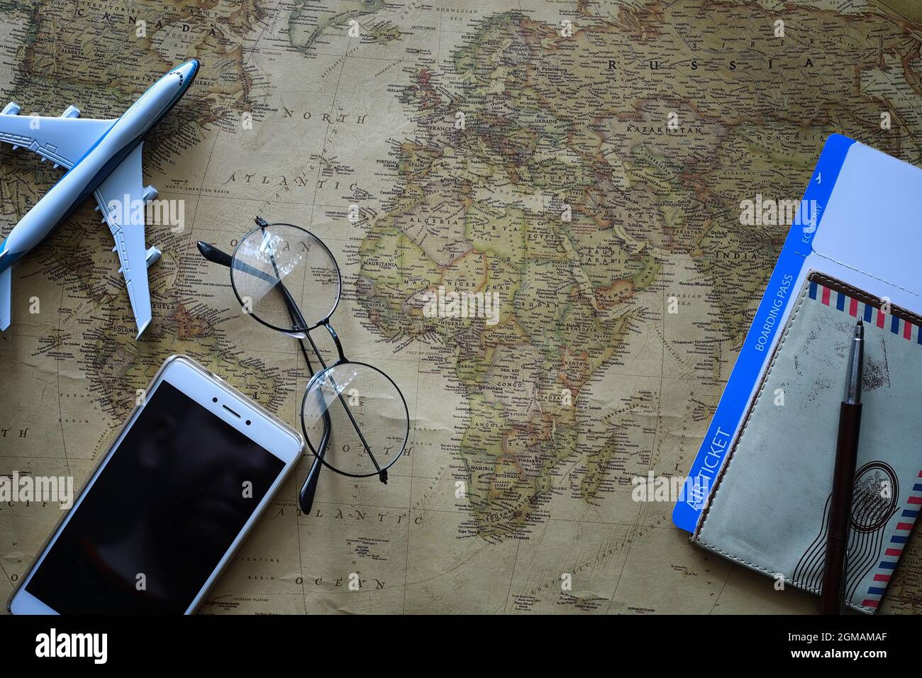 Travel concept. Map on the table and model aircraft Stock Photo - Alamy
