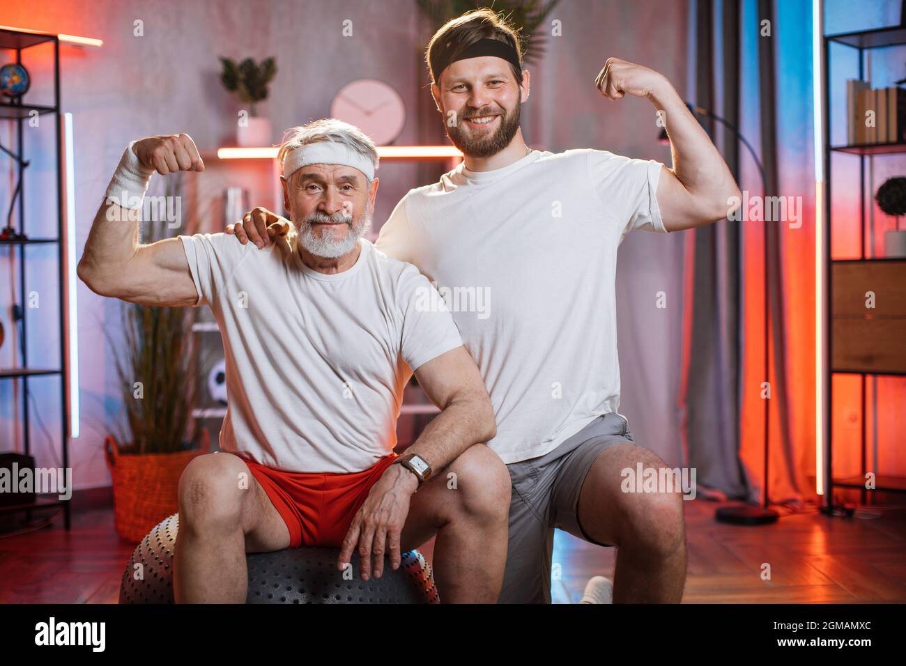 Father son showing muscles hi-res stock photography and images - Alamy
