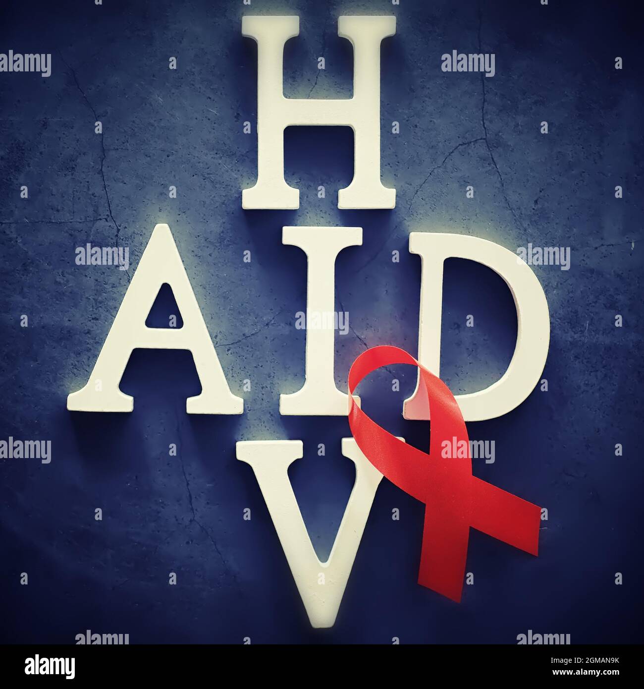 Symbol of human immunodeficiency virus disease. Red ribbon. A helping ...