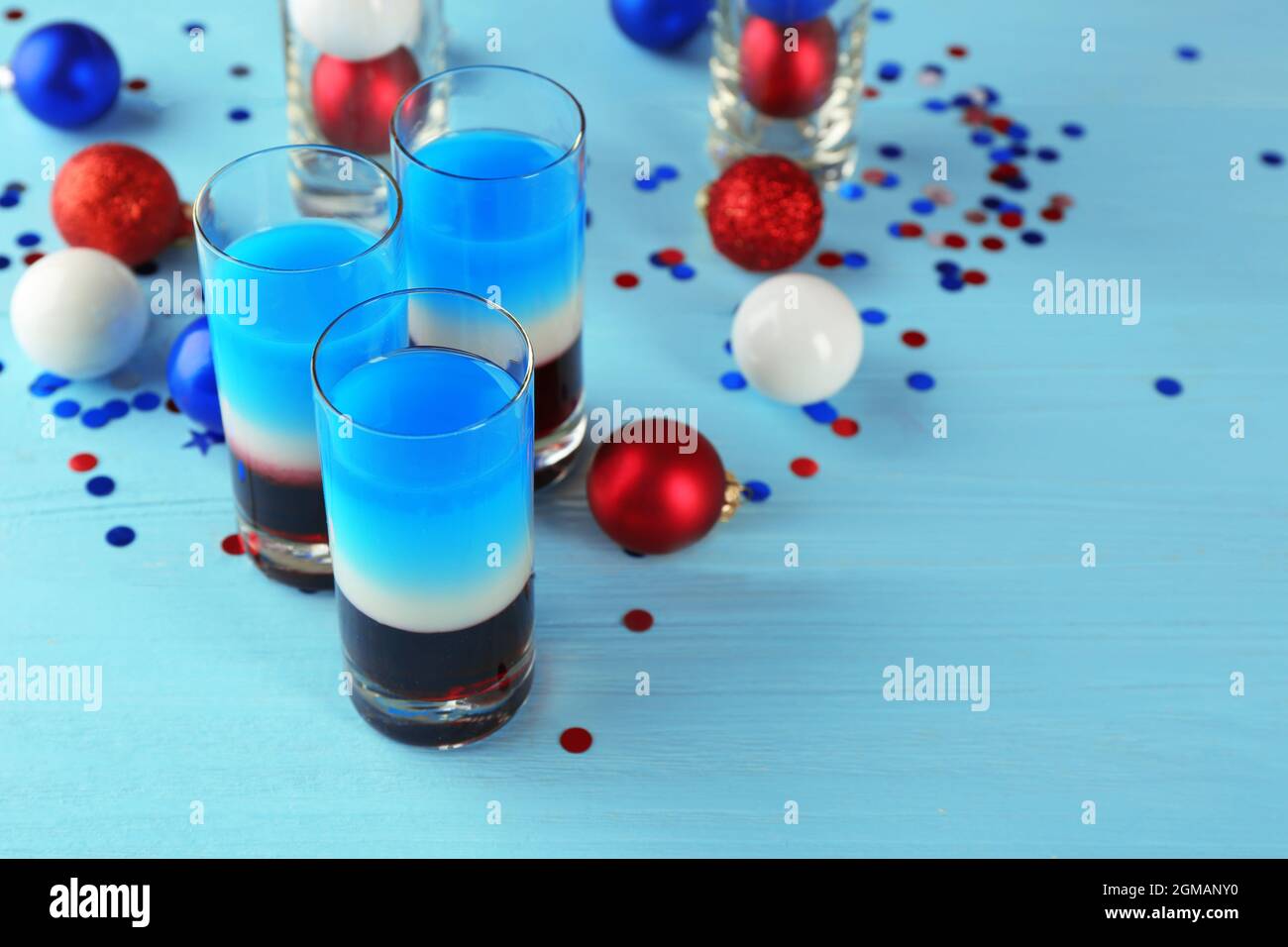 Layered cocktails in colors of American flag on table Stock Photo - Alamy