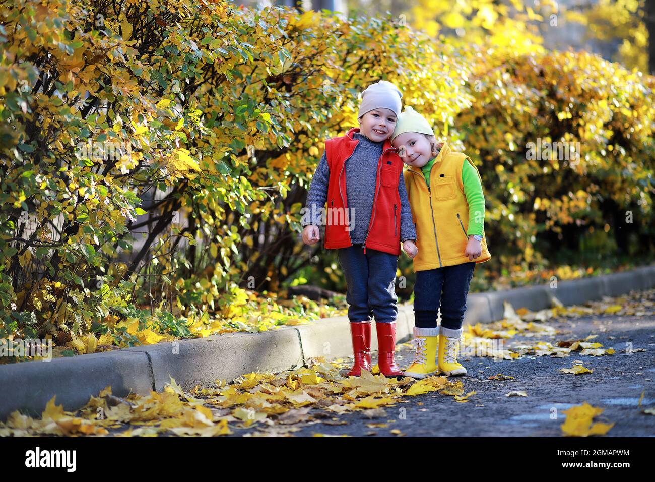 Children walk in the autumn park in the fall Stock Photo - Alamy