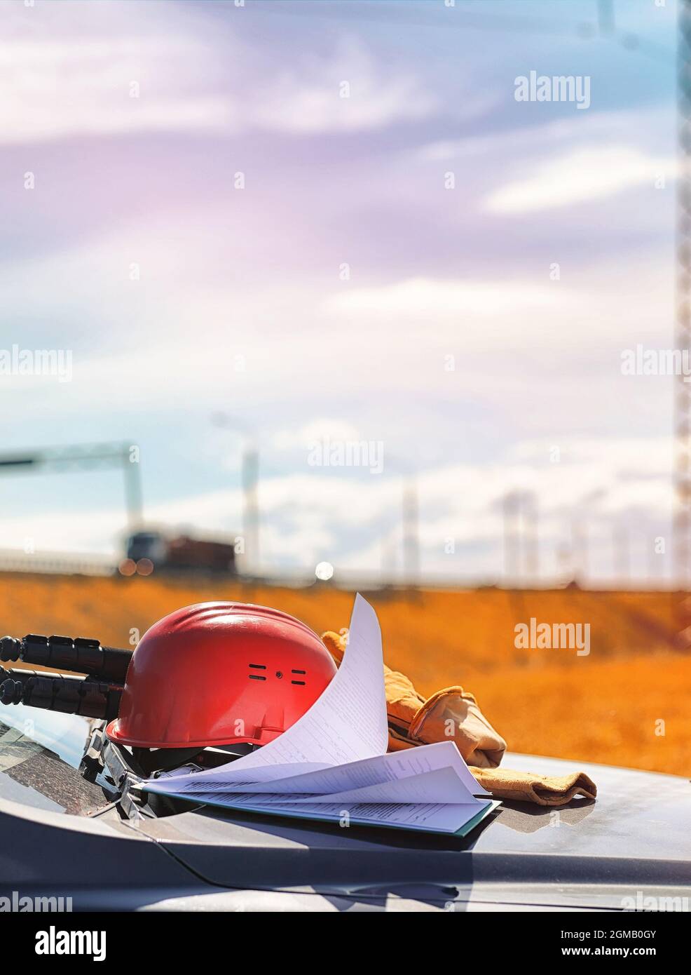 An electrician in the fields near the power transmission line. The ...