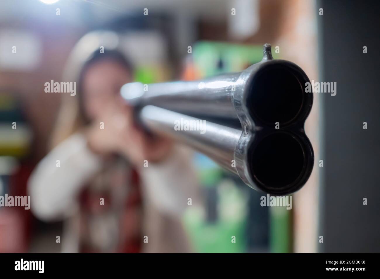 Vintage woman shooting shotgun hi-res stock photography and images - Alamy
