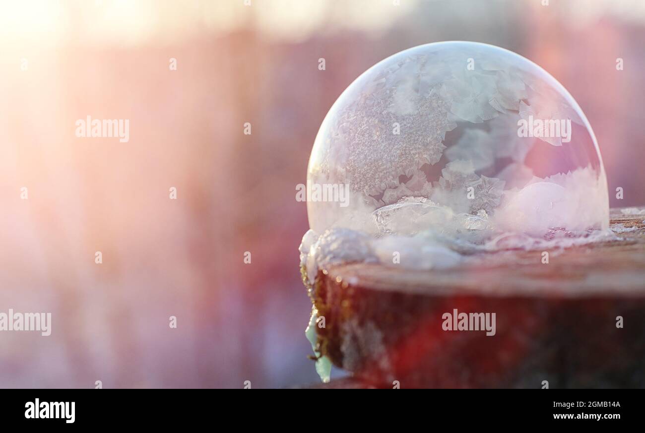 Soap bubbles freeze in the cold. Winter soapy water freezes in air ...