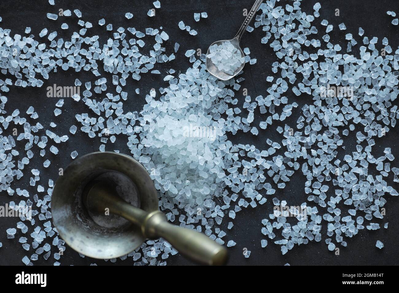 Large sea salt. Spice. Mortar and pestle for grinding salt Stock Photo ...